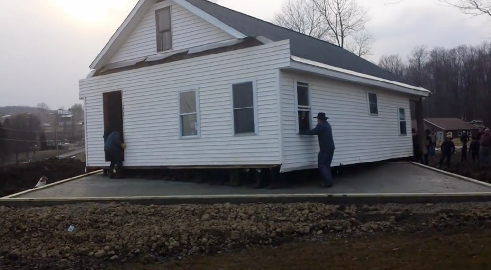 Watch 80 Amish Pick Up and Move a House by Hand (VIDEO)