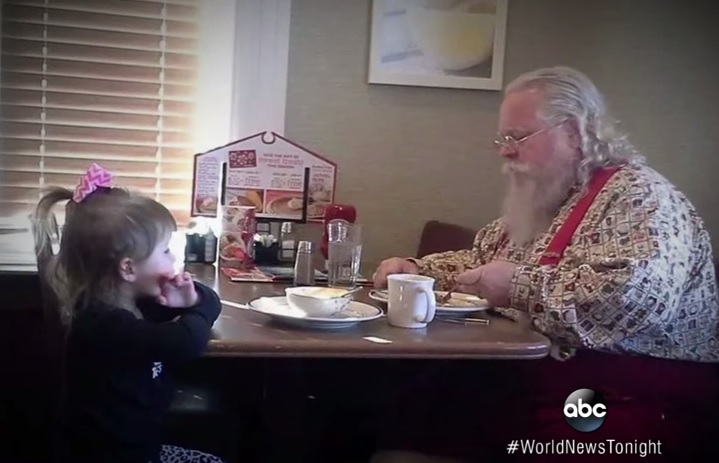 An Adorable Little Girl Won't Let Santa Eat Breakfast Alone
